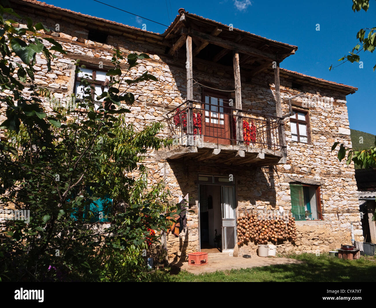 Traditional Macedonian farmhouse with onions drying outside in the ...