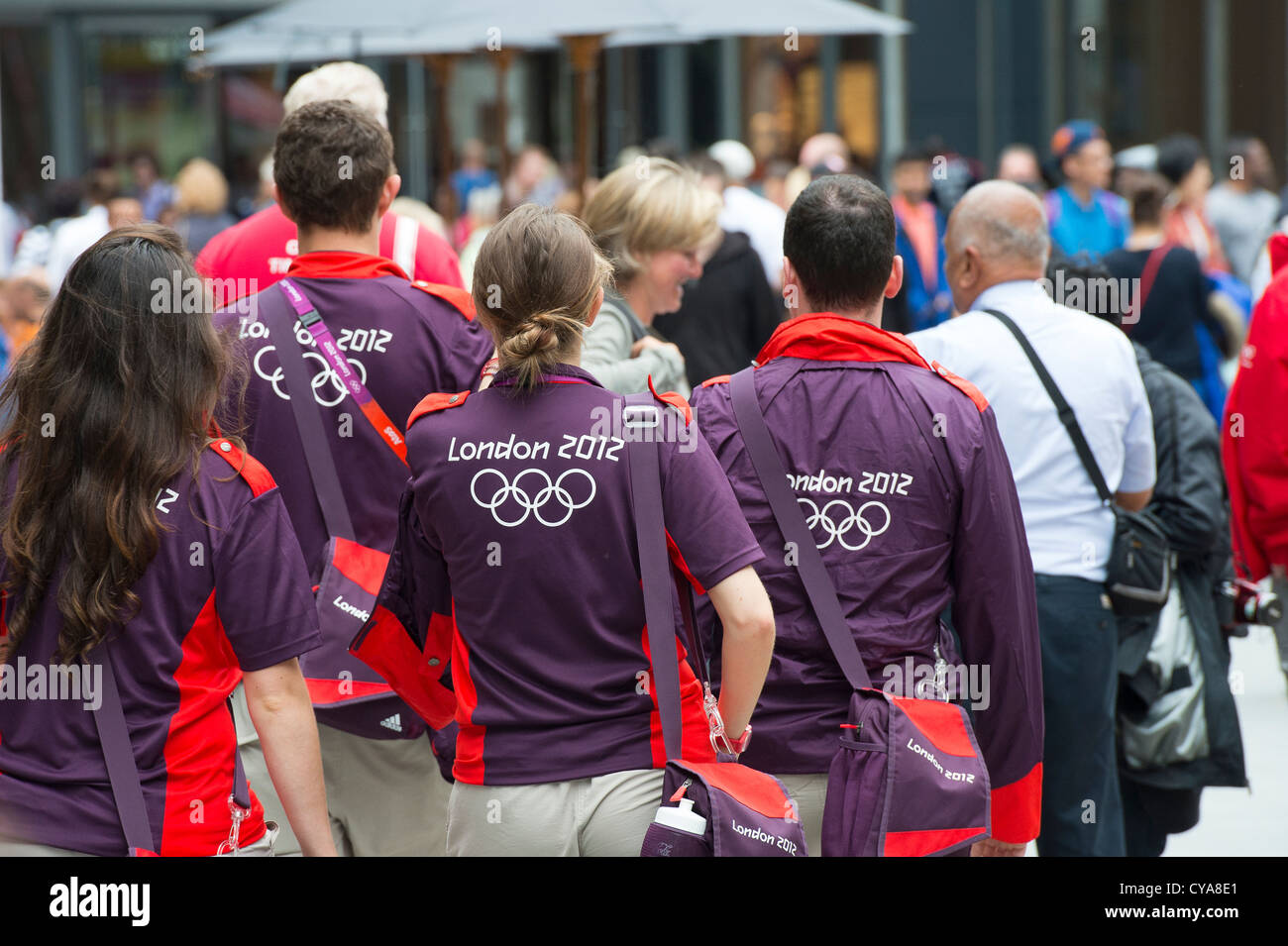Games makers assisting people queuing to enter the Olympic Park during ...