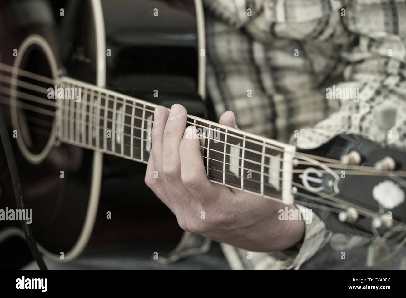 Close up of person playing a guitar Stock Photo - Alamy