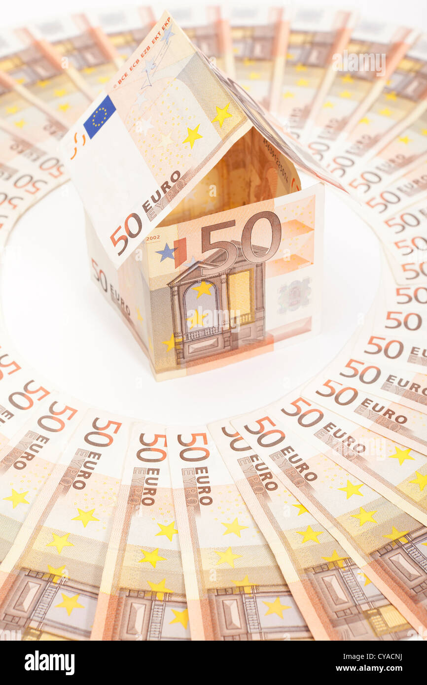 Conceptual house and banknotes Stock Photo - Alamy