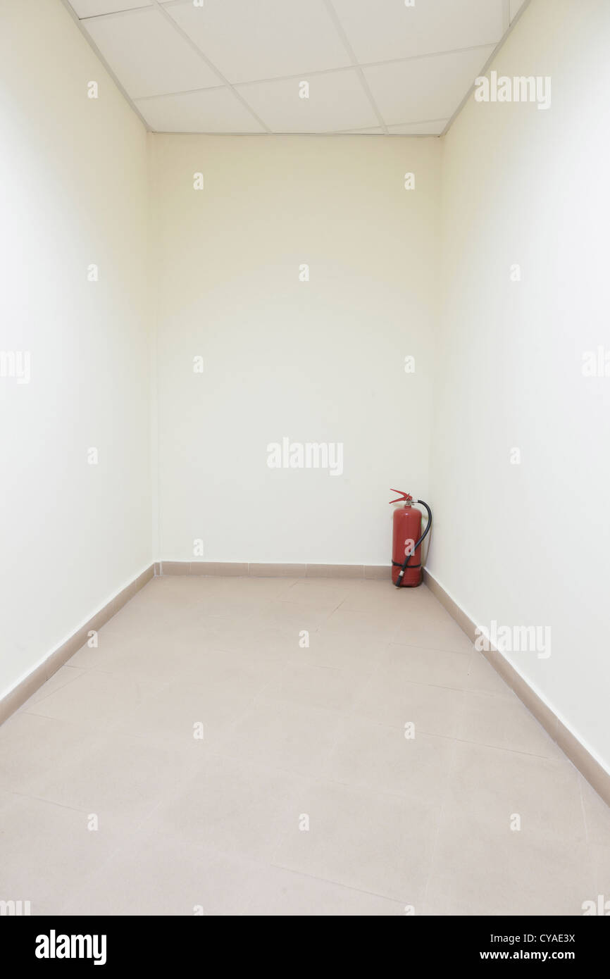 empty room with fire extinguisher Stock Photo - Alamy
