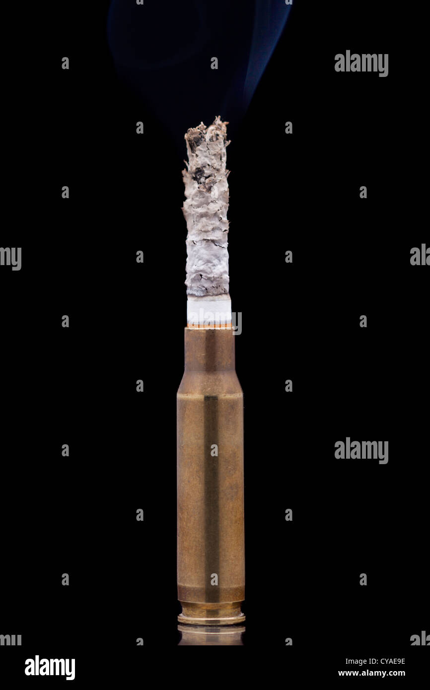 cigarette burned like a bullet isolated black Stock Photo - Alamy
