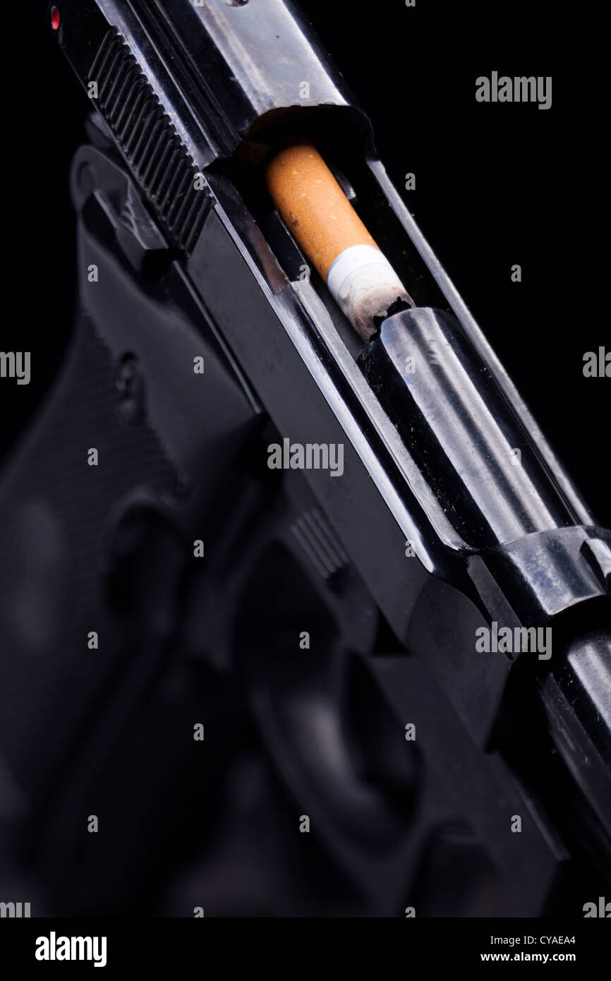 cigarette burned like a bullet in the barrel of a gun Stock Photo - Alamy