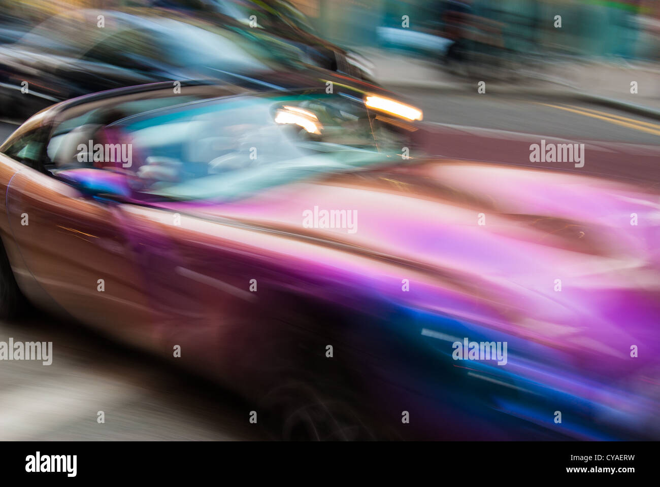 Fancy sports car in motion Stock Photo - Alamy