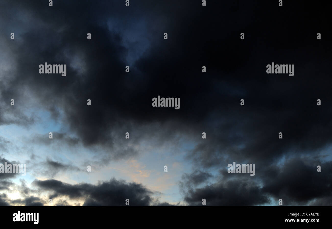 Dramatic sky with black cloud formation over town of Ambleside in the ...