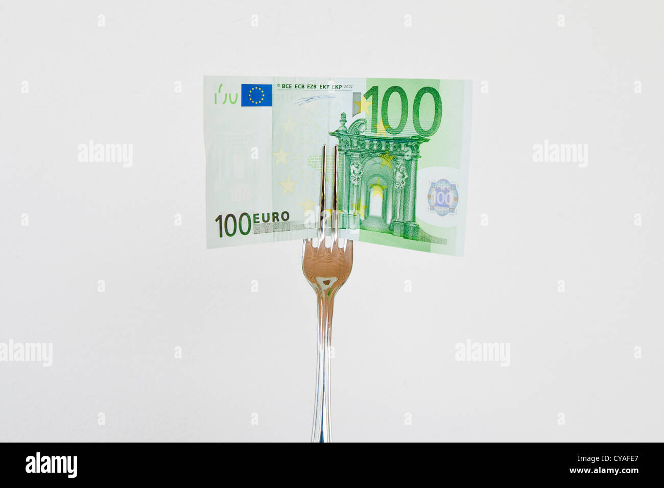 money and fork Stock Photo - Alamy
