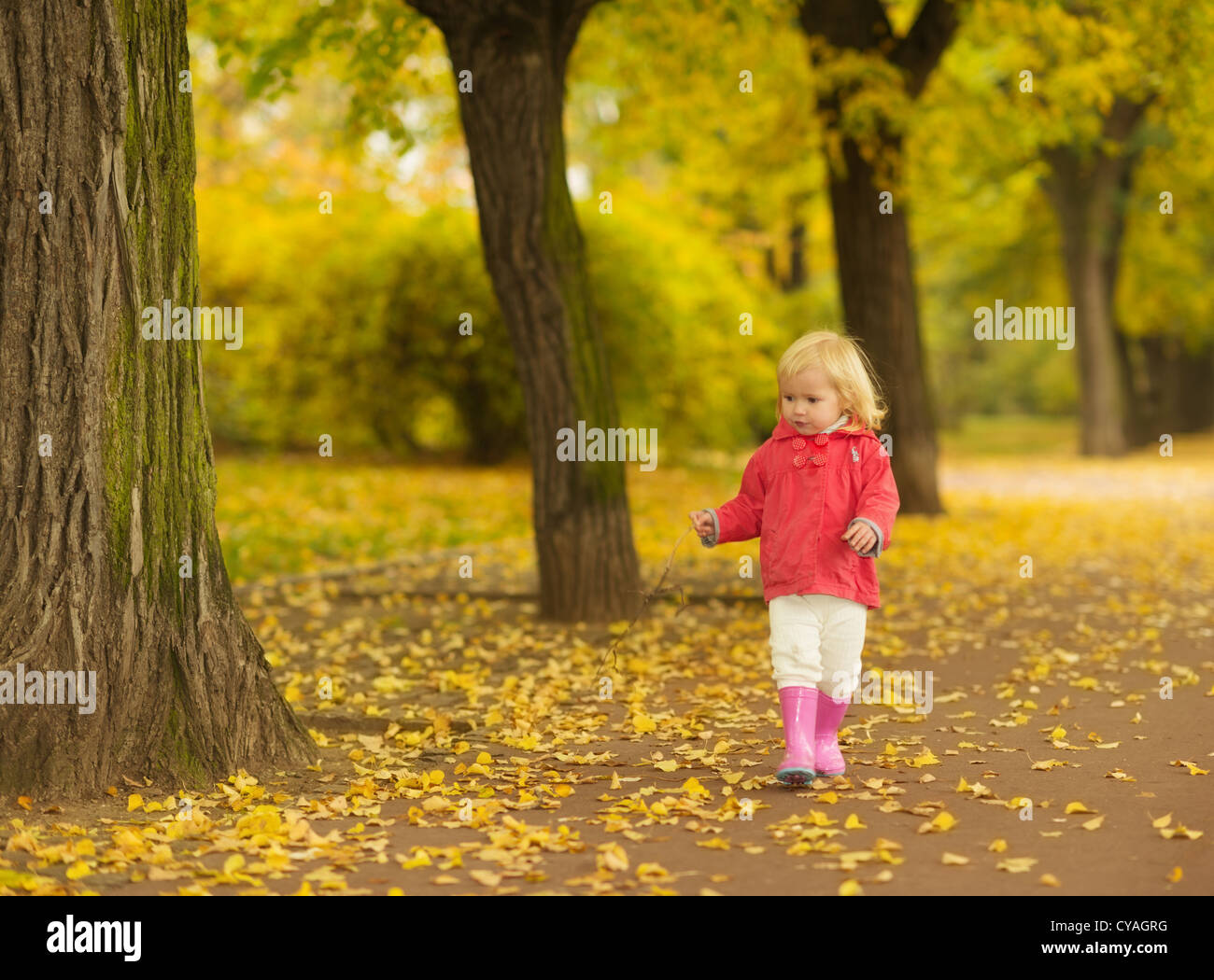 Baby running in park Stock Photo - Alamy
