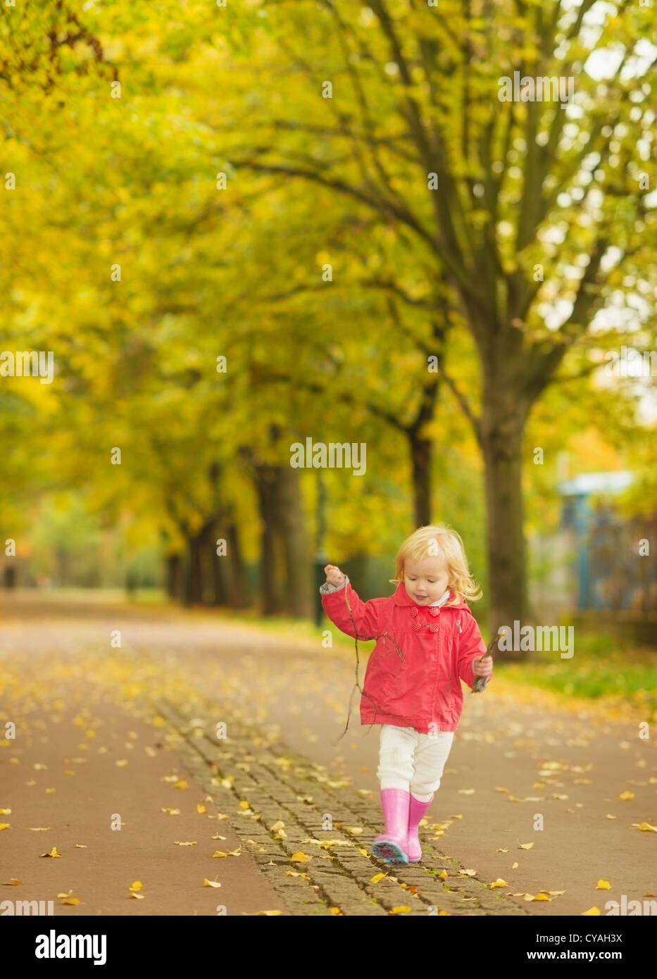 Baby running in park Stock Photo - Alamy