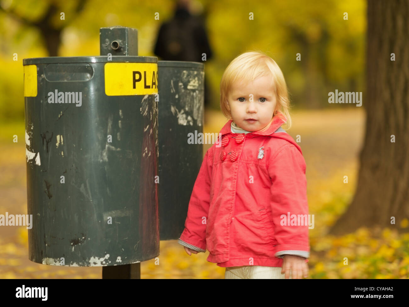 Portrait of baby near trash can Stock Photo - Alamy