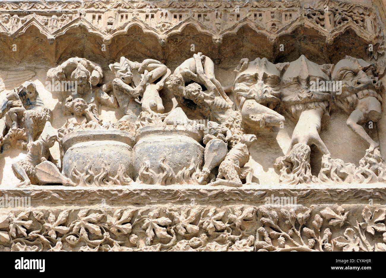 Frieze of demons eating sinners and stuffing them into cauldrons on the ...