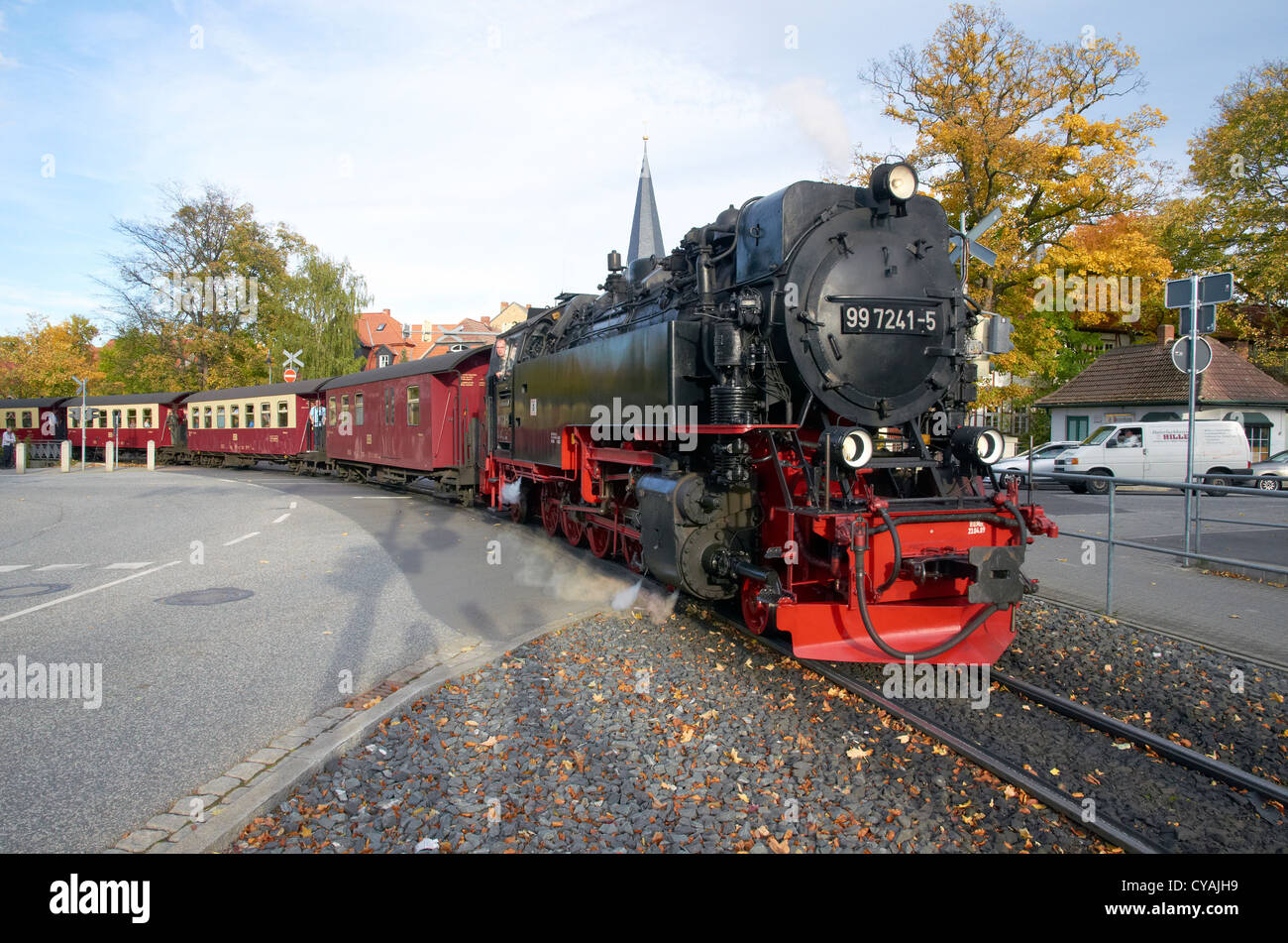 Harzer Schmalspurbahnen steam train on road crossing in Wernigerode ...
