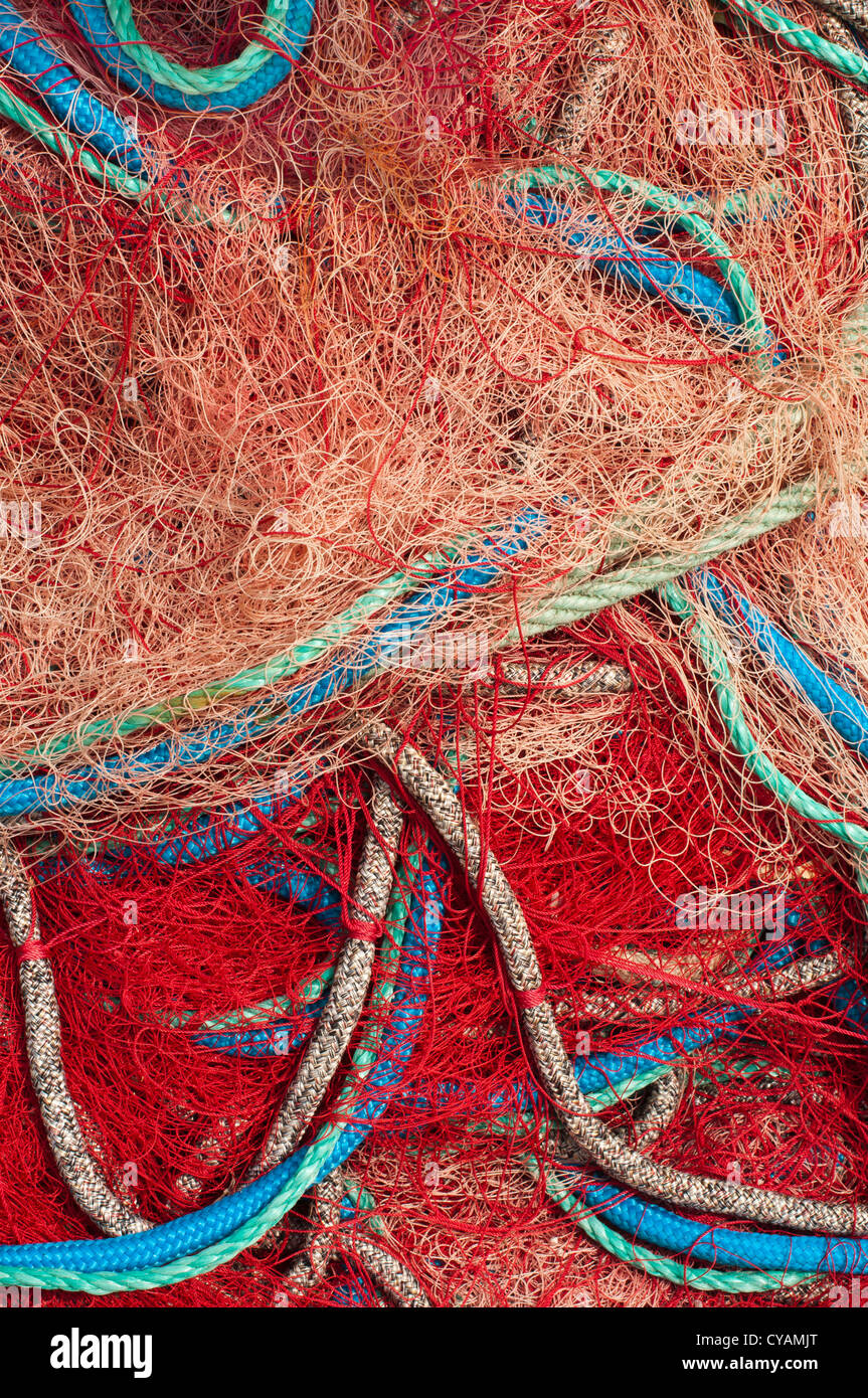 Red color fishing nets background Stock Photo - Alamy