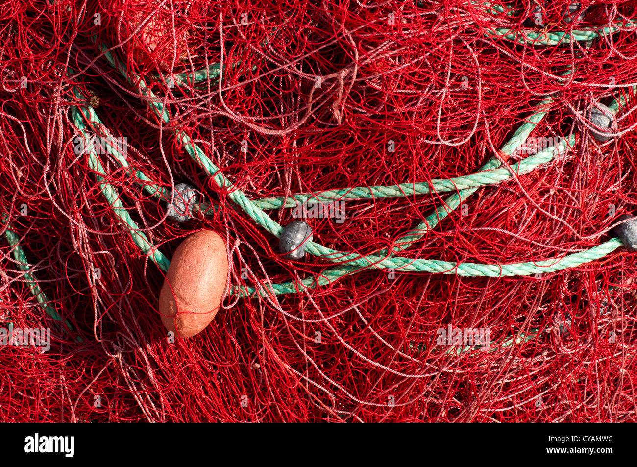 Red color fishing nets background Stock Photo - Alamy