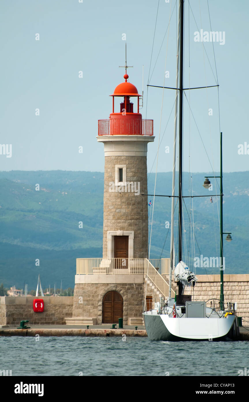Port light in Saint Tropez and anchored boat Stock Photo - Alamy