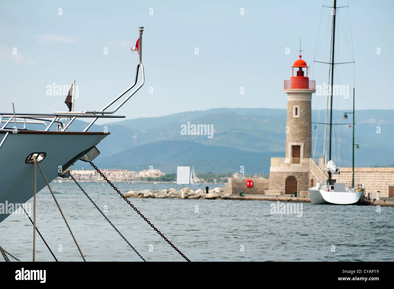 Port light in Saint Tropez and anchored boat Stock Photo - Alamy
