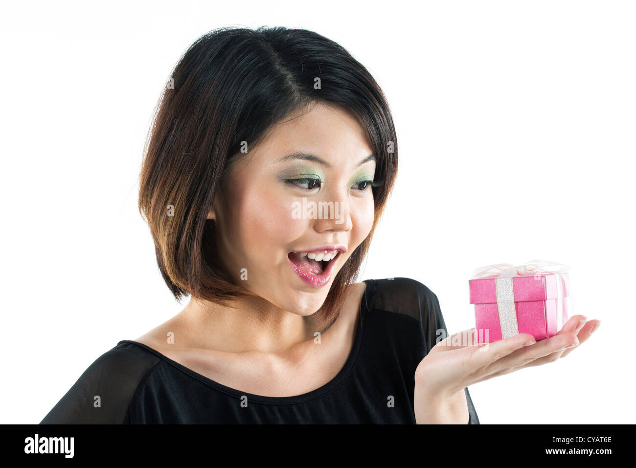 Happy Chinese girl with a gift in her hand Stock Photo - Alamy