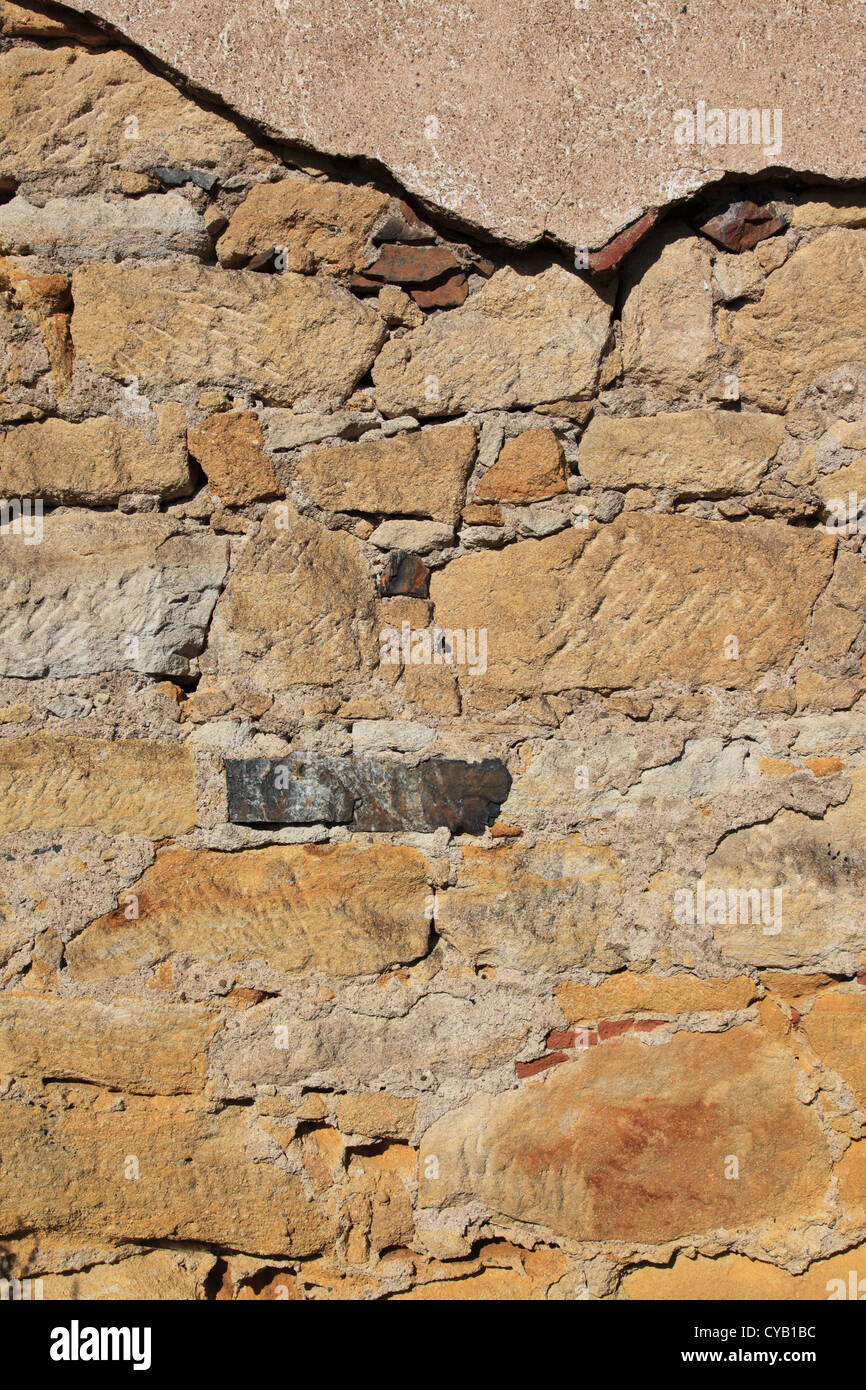 wall of a house with debris, cracked and collapsed facade. Photo by ...