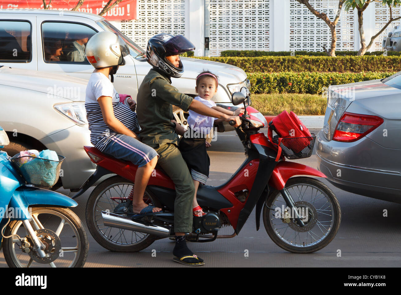 Family on Motorcycle in Vientiane, Laos Stock Photo - Alamy