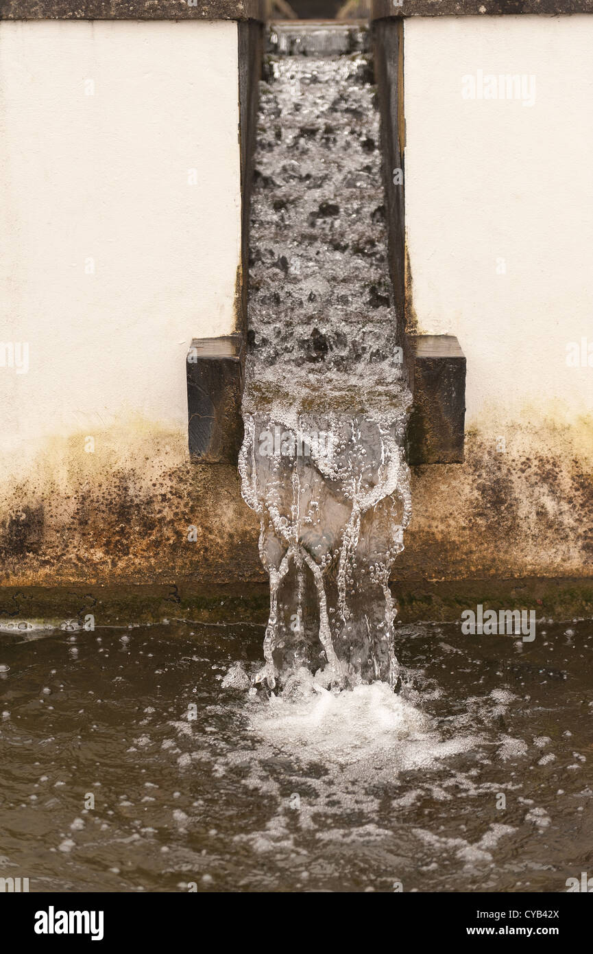 Waterfall and water stream in channel canal cutting flowing over ...
