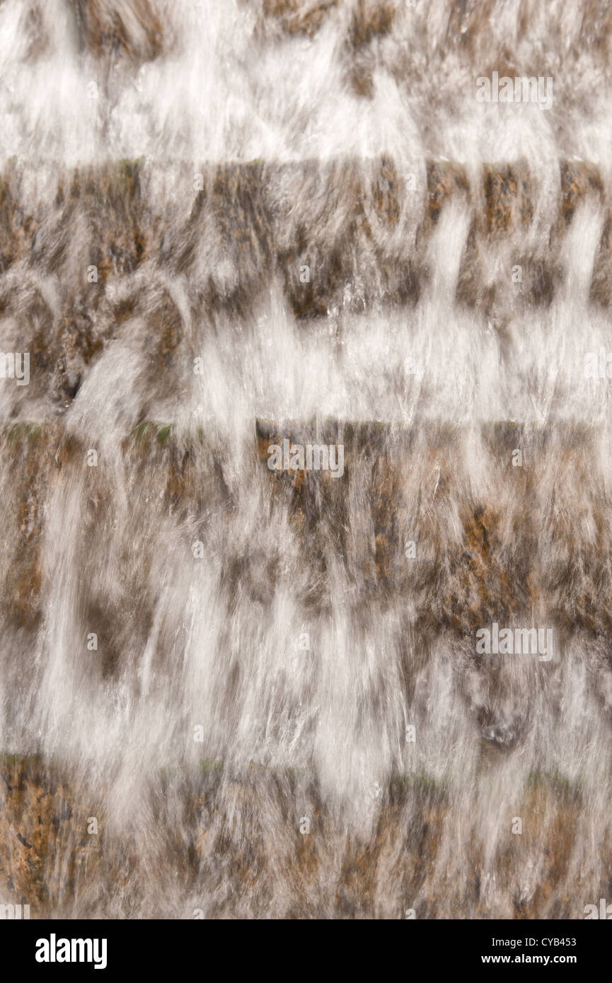 Waterfall and water stream in channel canal cutting flowing over ...