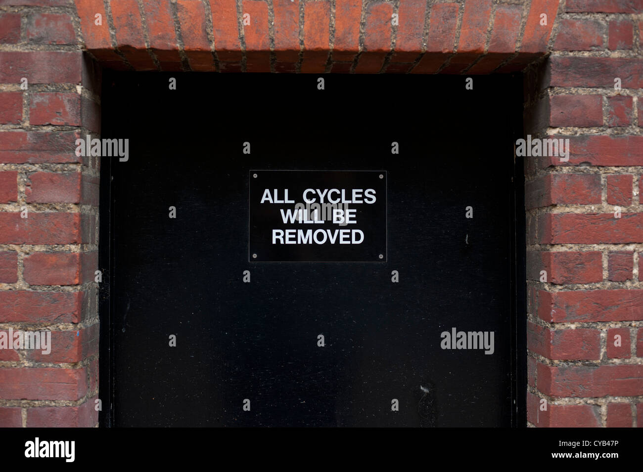 Simple warning sign on a door that all bikes will be removed Stock ...