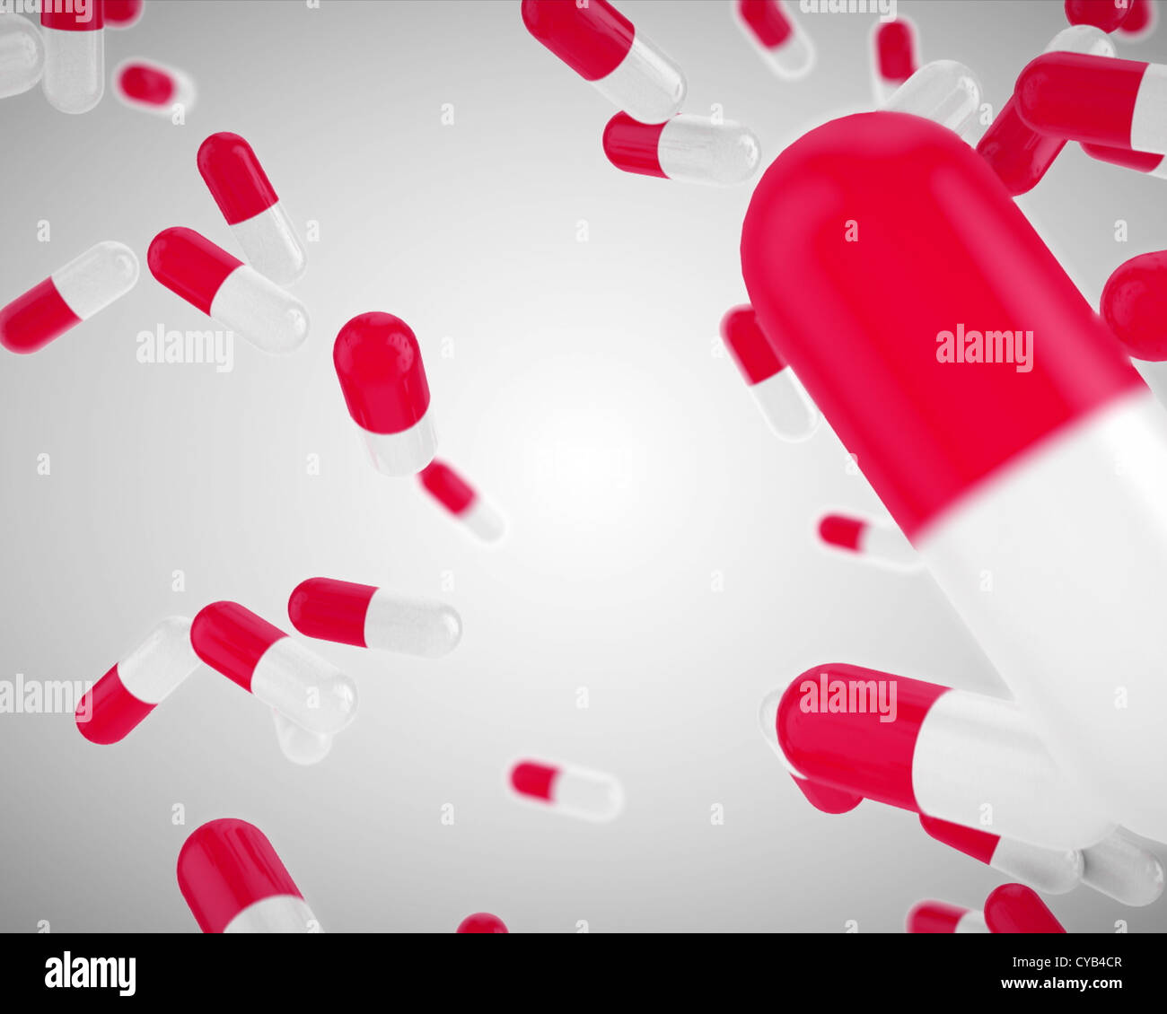 Floating pink pills Stock Photo - Alamy