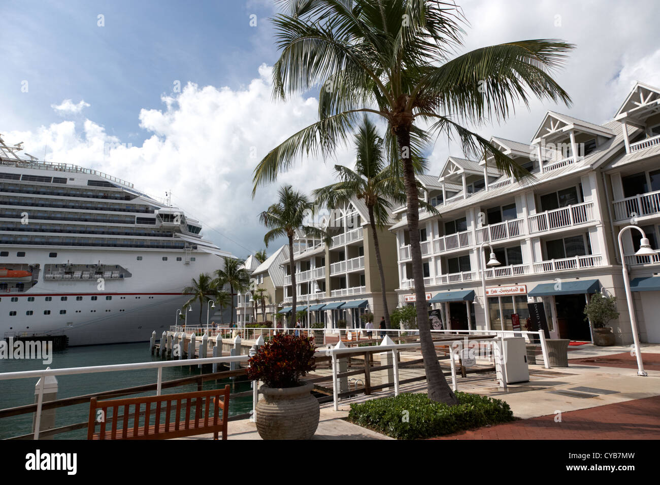 sunset waterfront shoppes and carnival freedom cruise ship moored off ...