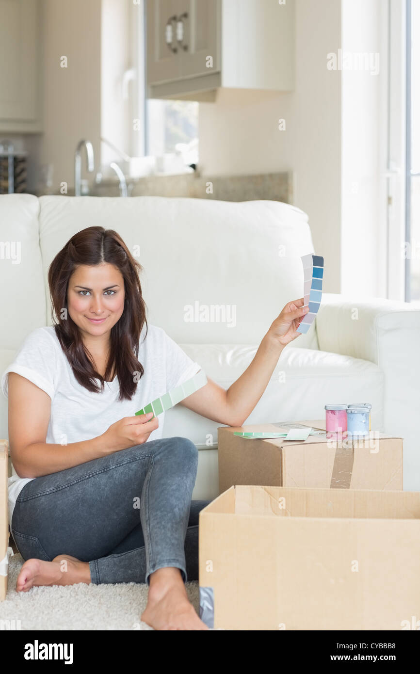 Woman deciding colour for room Stock Photo - Alamy