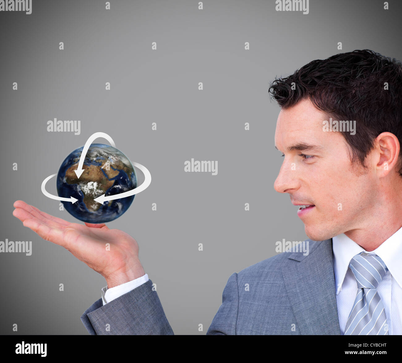 Hovering globe in Businessman's hand Stock Photo - Alamy