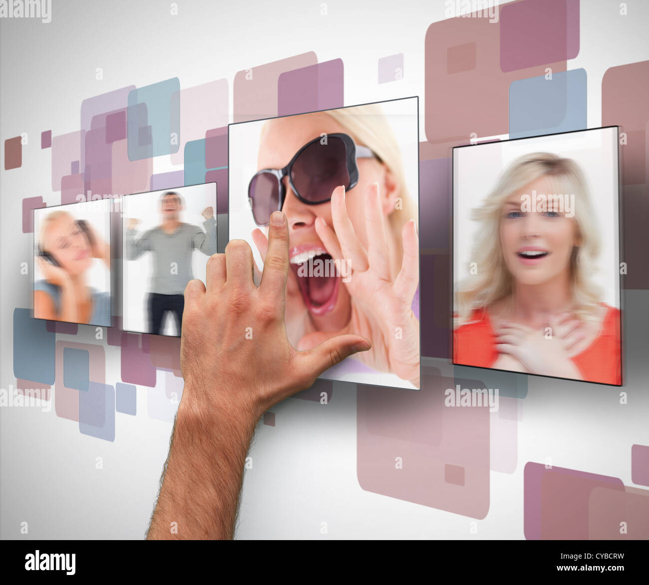 Male hand selecting one photo from digital wall Stock Photo - Alamy