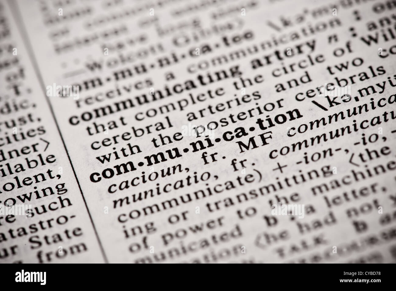 Closeup of a page in an English dictionary with the syllabicated word ...