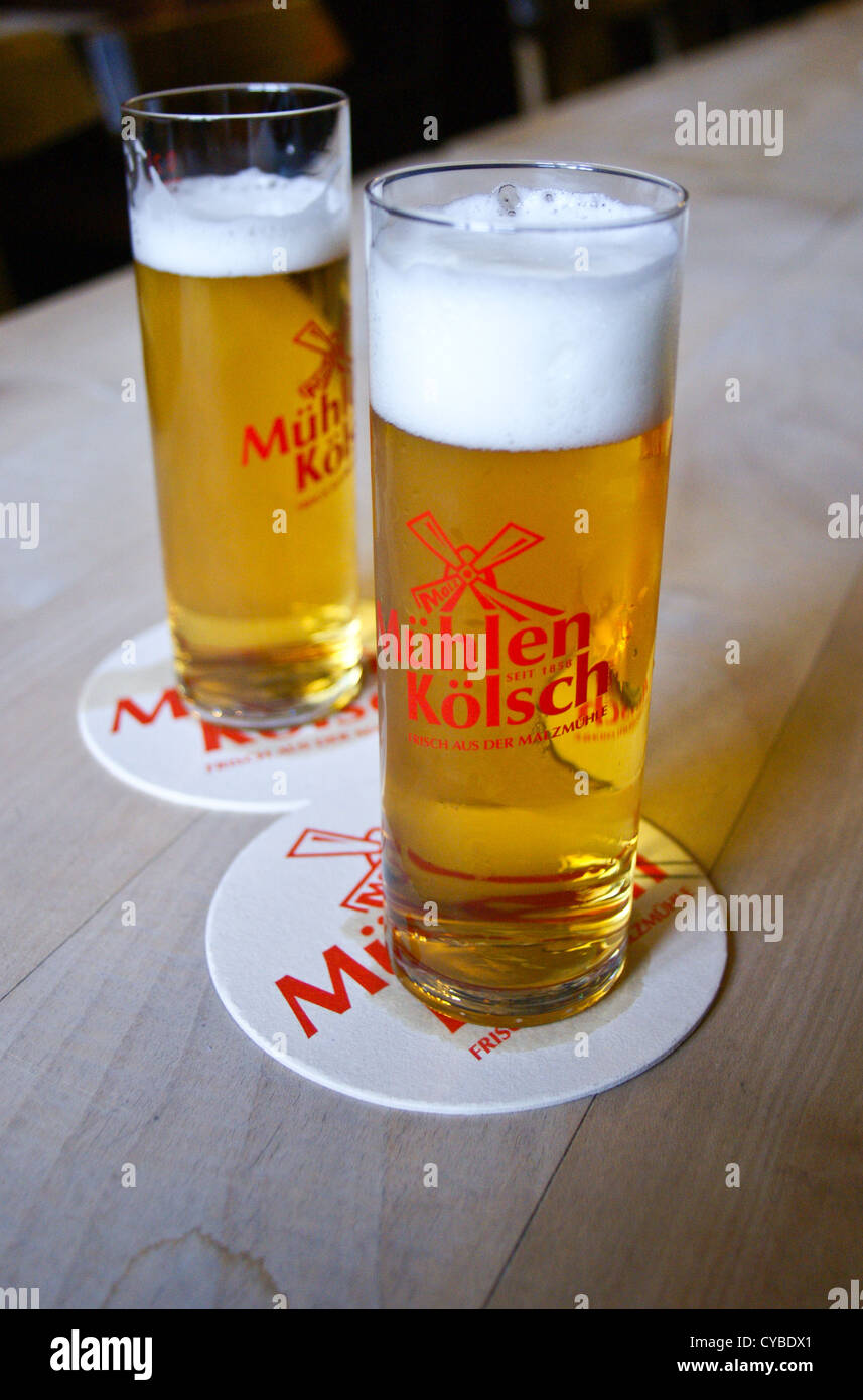 A printed glass of Muhlen Kölsch ale on a bar in Cologne, Köln ...