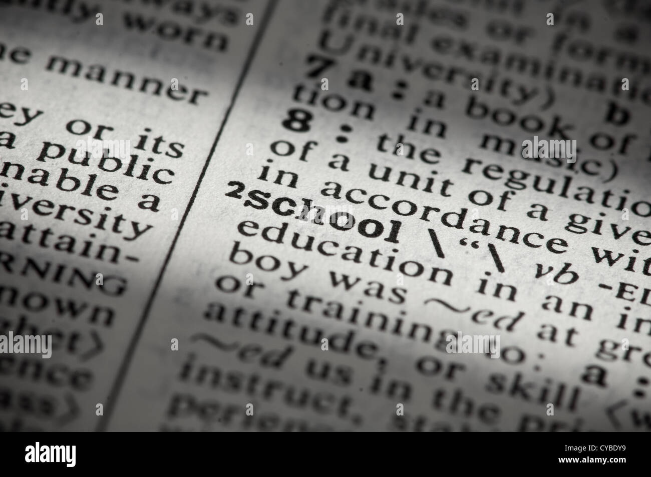 Closeup of a page in an English dictionary with the word "school ...