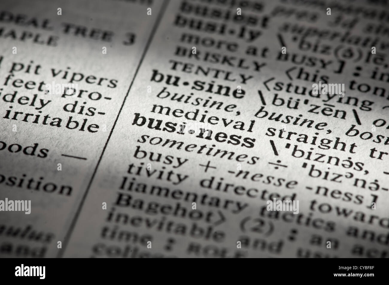 Closeup of the word "business" split into two syllables, along with its ...