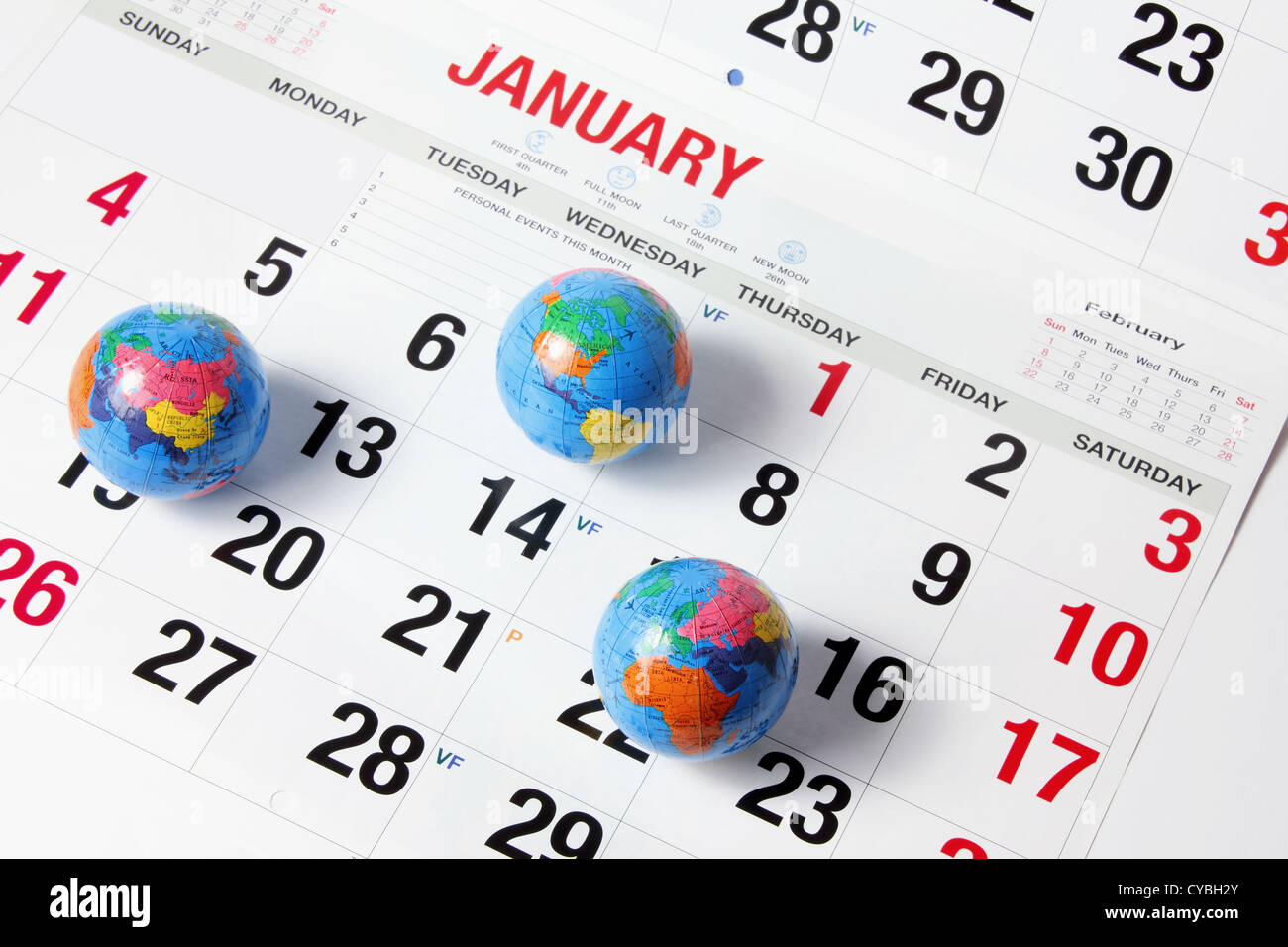 Globes on Calendar Pages Stock Photo - Alamy