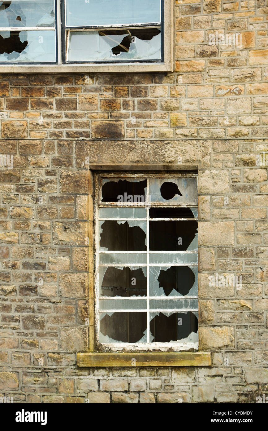 Derelict factory and broken windows in a redevelopment area on the ...