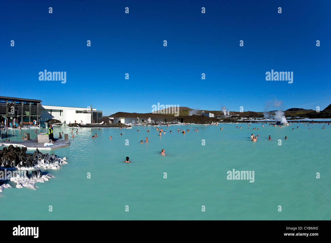 Tourists and visitors enjoy outdoor geothermal swimming pool at the ...