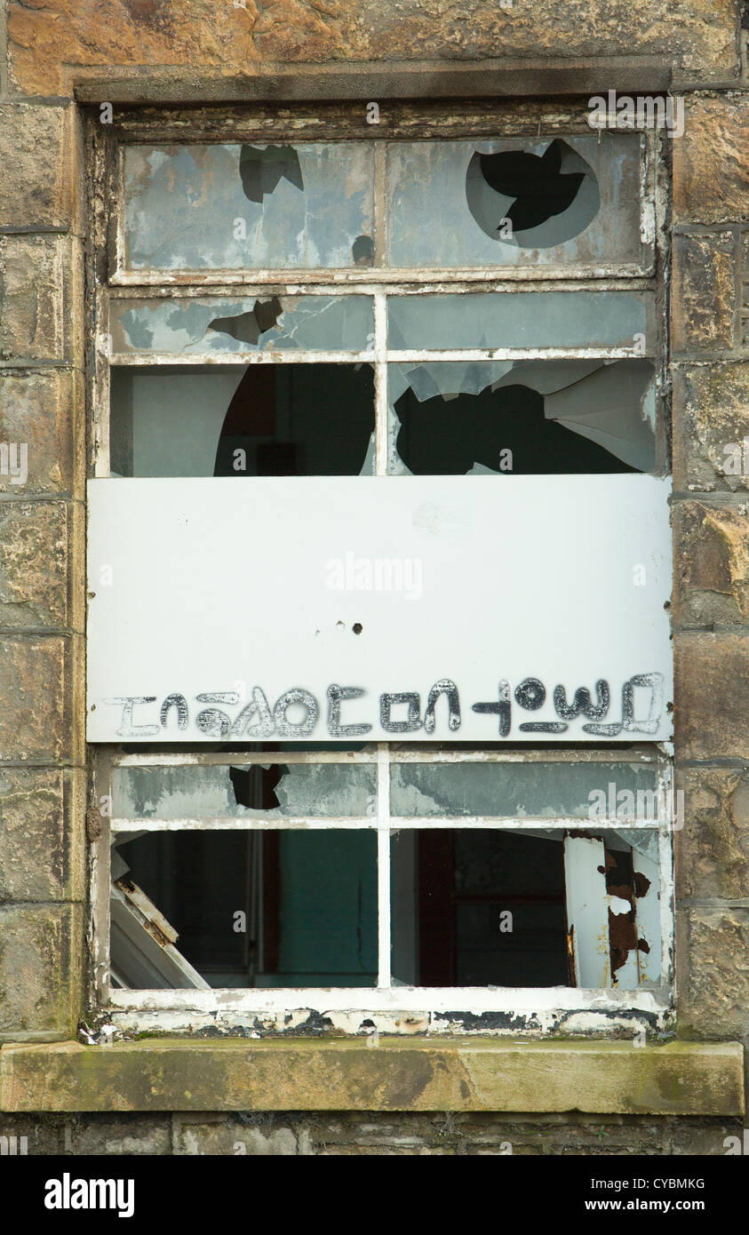 Derelict factory and broken windows in a redevelopment area on the ...
