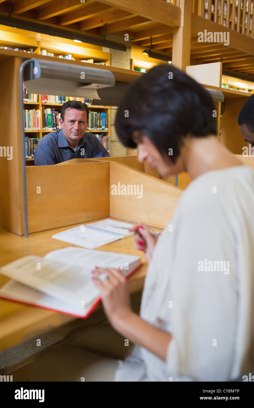 Man sitting at study desk Stock Photo - Alamy