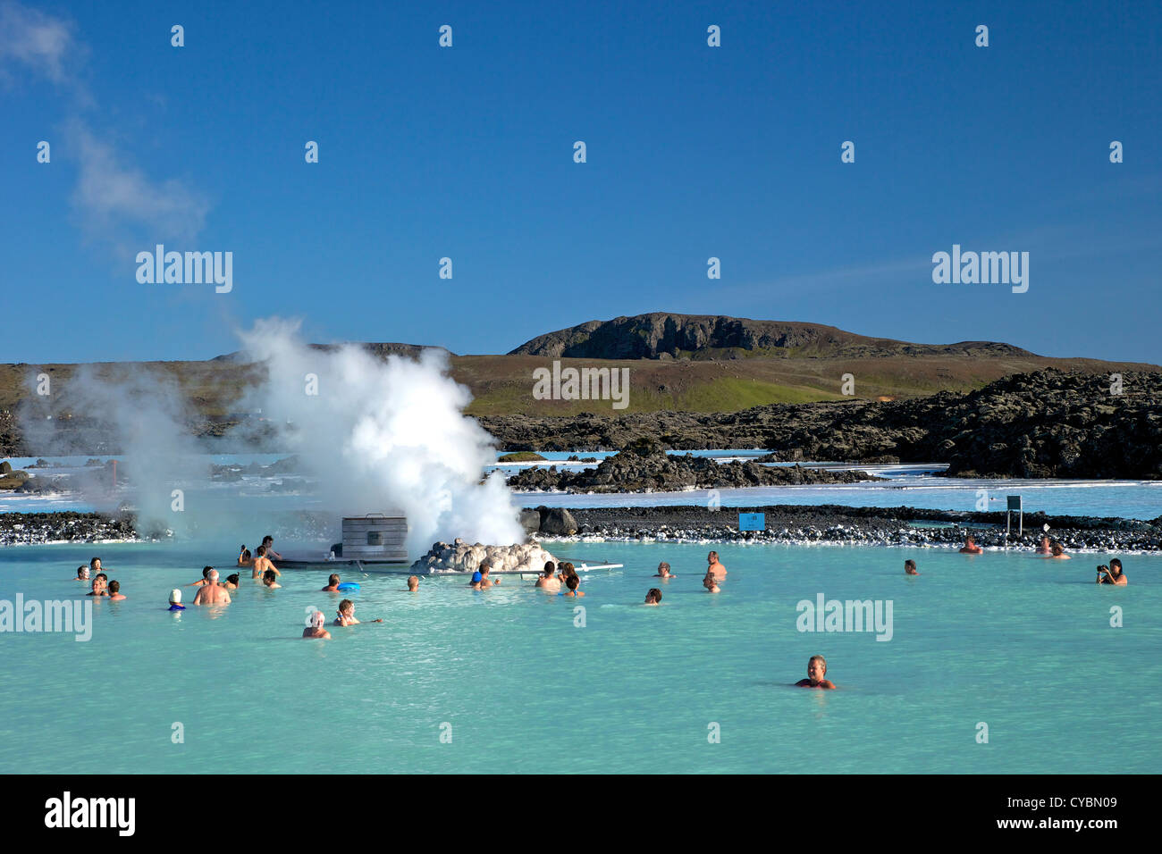 Tourists and visitors enjoy outdoor geothermal swimming pool at the ...