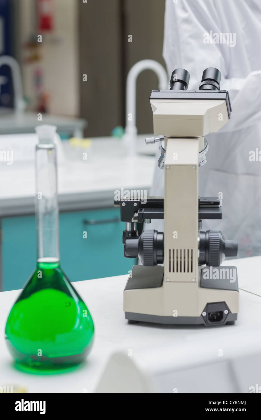 Microscope and green chemical Stock Photo - Alamy