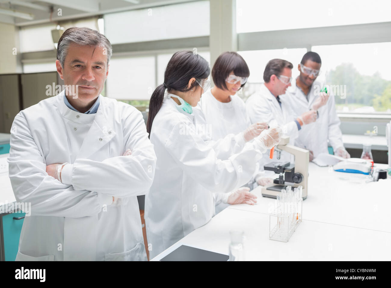 Chemist in busy lab Stock Photo - Alamy