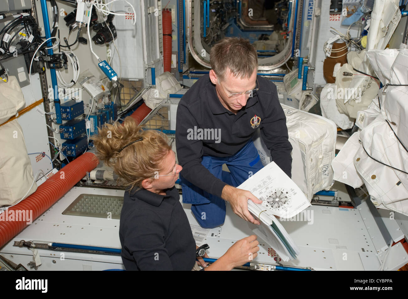 Sandy Magnus and Chris Ferguson in the Harmony node Stock Photo - Alamy