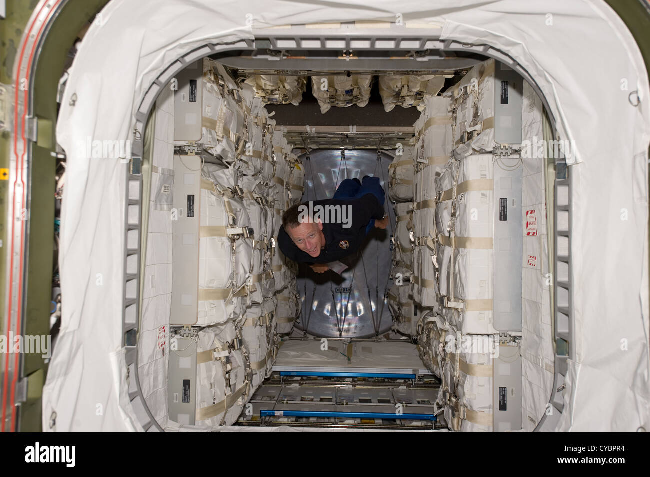 During STS-135, Chris Ferguson floats inside the Raffaello Multi ...