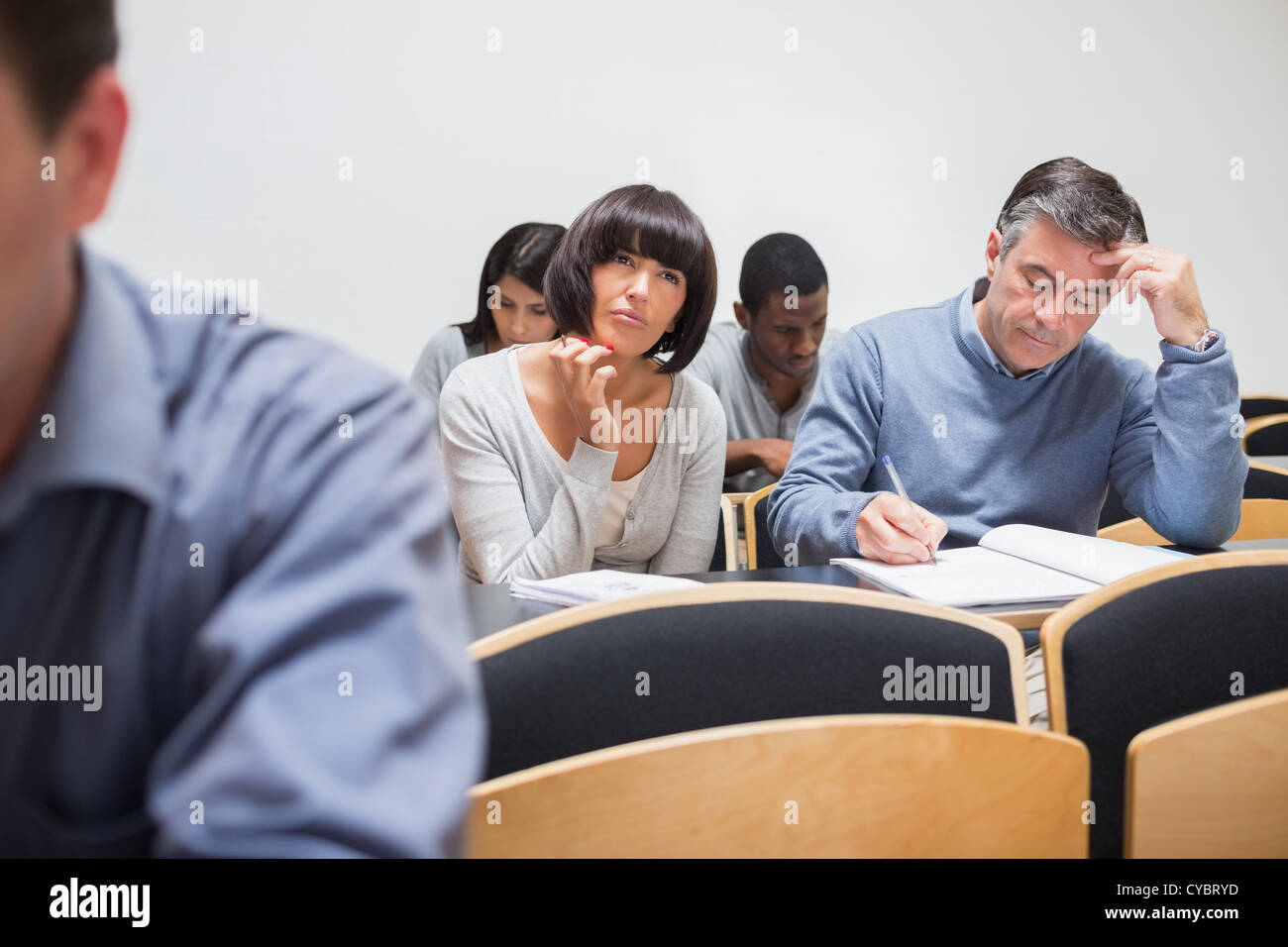 Students sitting in the class and thinking Stock Photo - Alamy