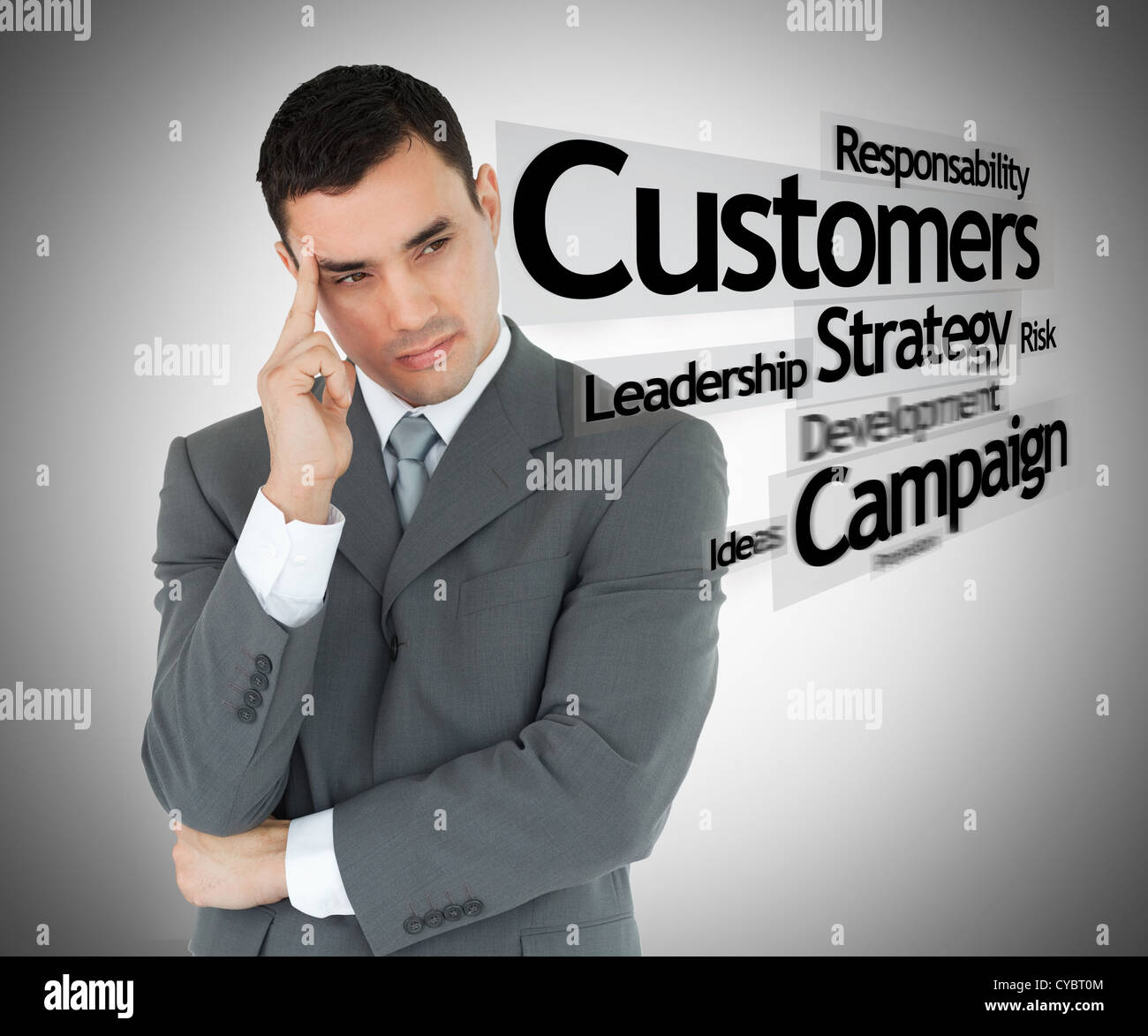 Businessman standing thinking grey background Stock Photo - Alamy Businessman standing thinking grey background Stock Photo - Alamy