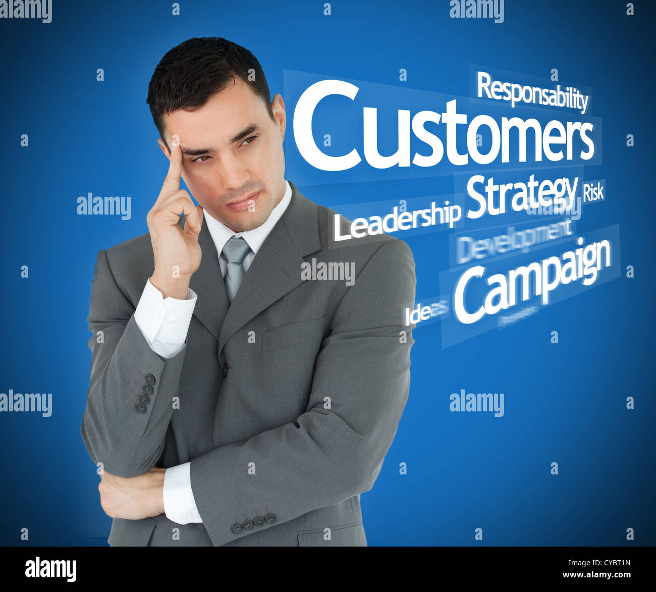 Businessman standing thinking blue background Stock Photo - Alamy Businessman standing thinking blue background Stock Photo - Alamy