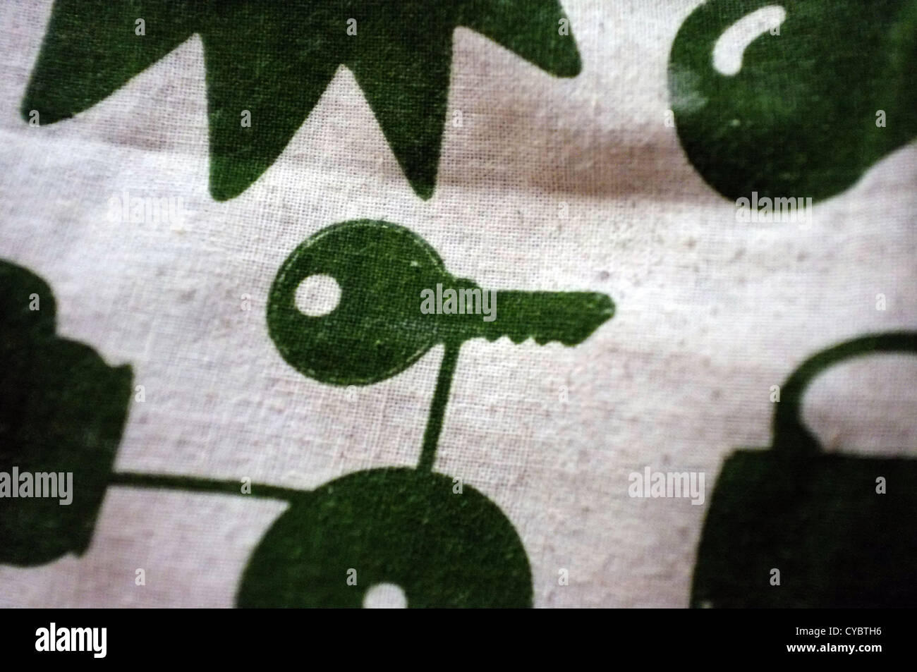 A green key symbol on a fabric bag Stock Photo - Alamy