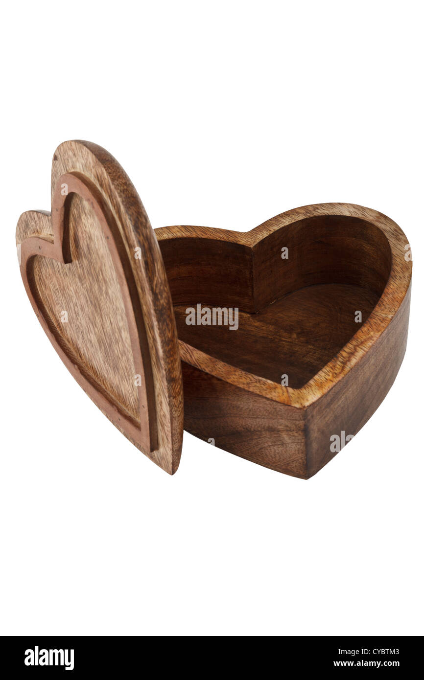 Carved wooden box in the shape of a love heart, isolated on white with ...