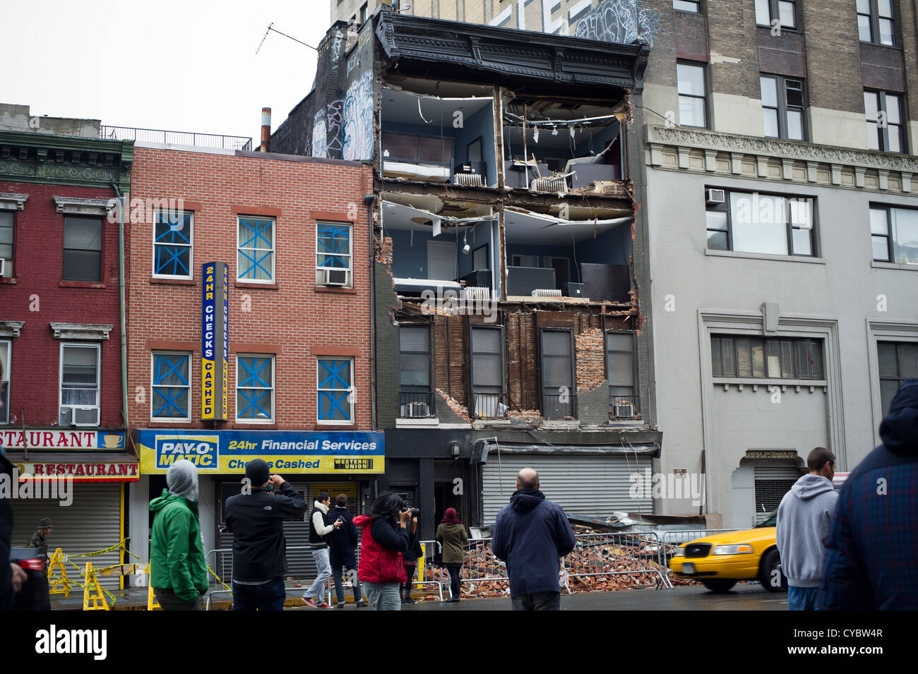 The facade of a building in Chelsea in New York is torn off during ...